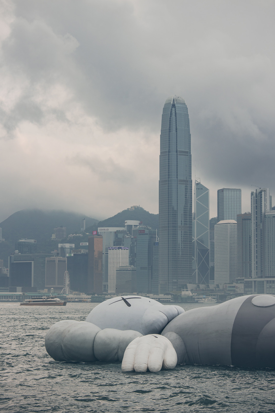 Giant KAWS figure floating in the sea on display for 10 days in Hong ...